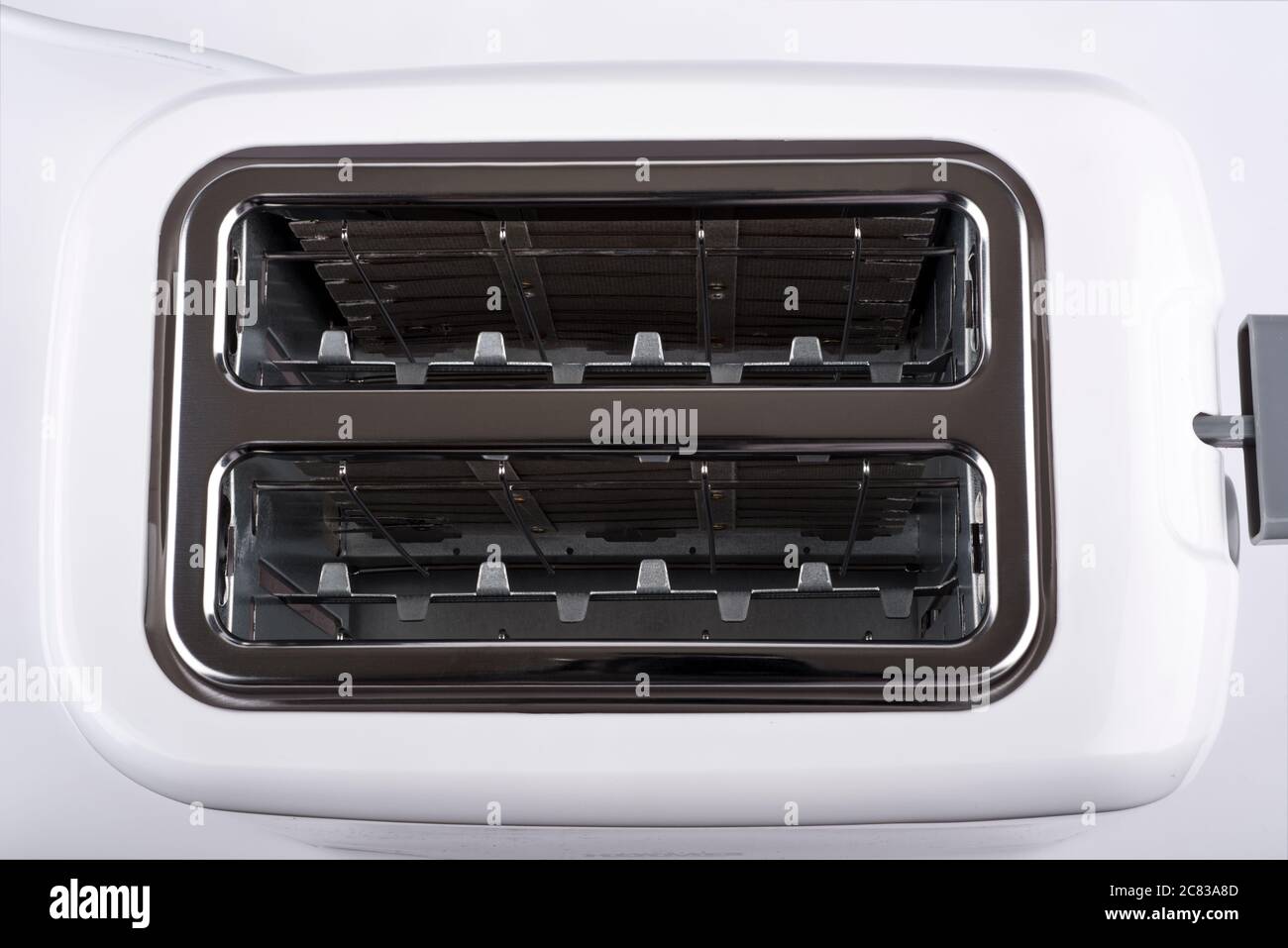 Toaster with two compartments for roasting bread at the same time ...