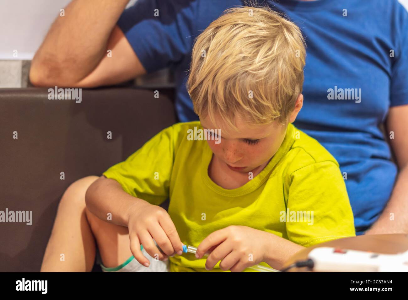 Sitting on dads lap hi-res stock photography and images - Alamy