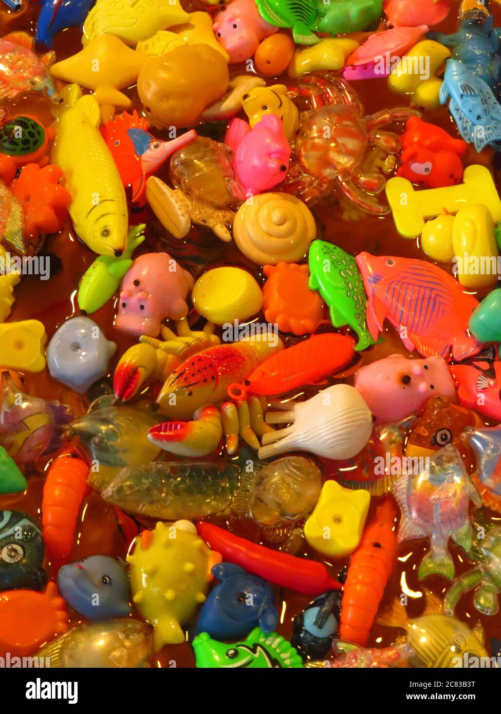 Little, colourful and plastic toys in the water Stock Photo - Alamy