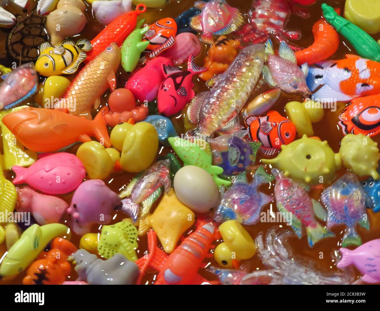 Little, colourful and plastic toys in the water Stock Photo - Alamy