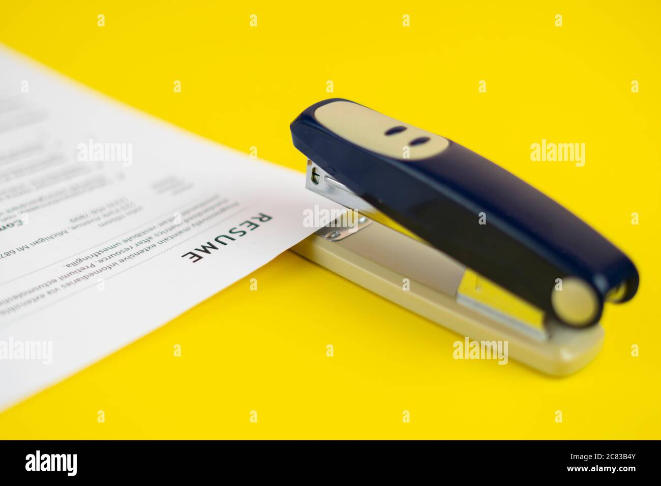 a stapler and the documents files in office on the table, staple the ...