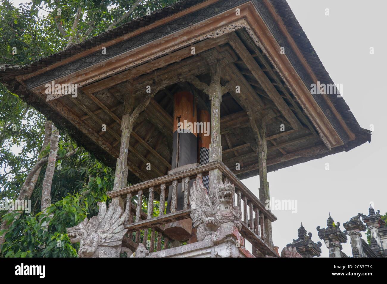 Wooden bell with a mallet made from a tree trunk. Bale Kulkul is ...