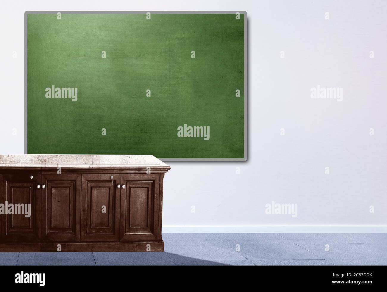 Desk and chalkboard inside the classroom with white wall background ...