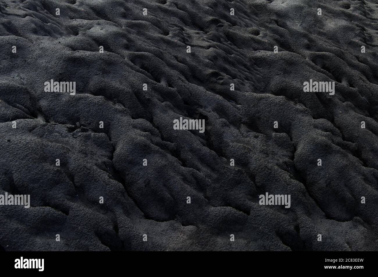 Grayscale shot of the sand under the lights - cool for wallpapers and ...
