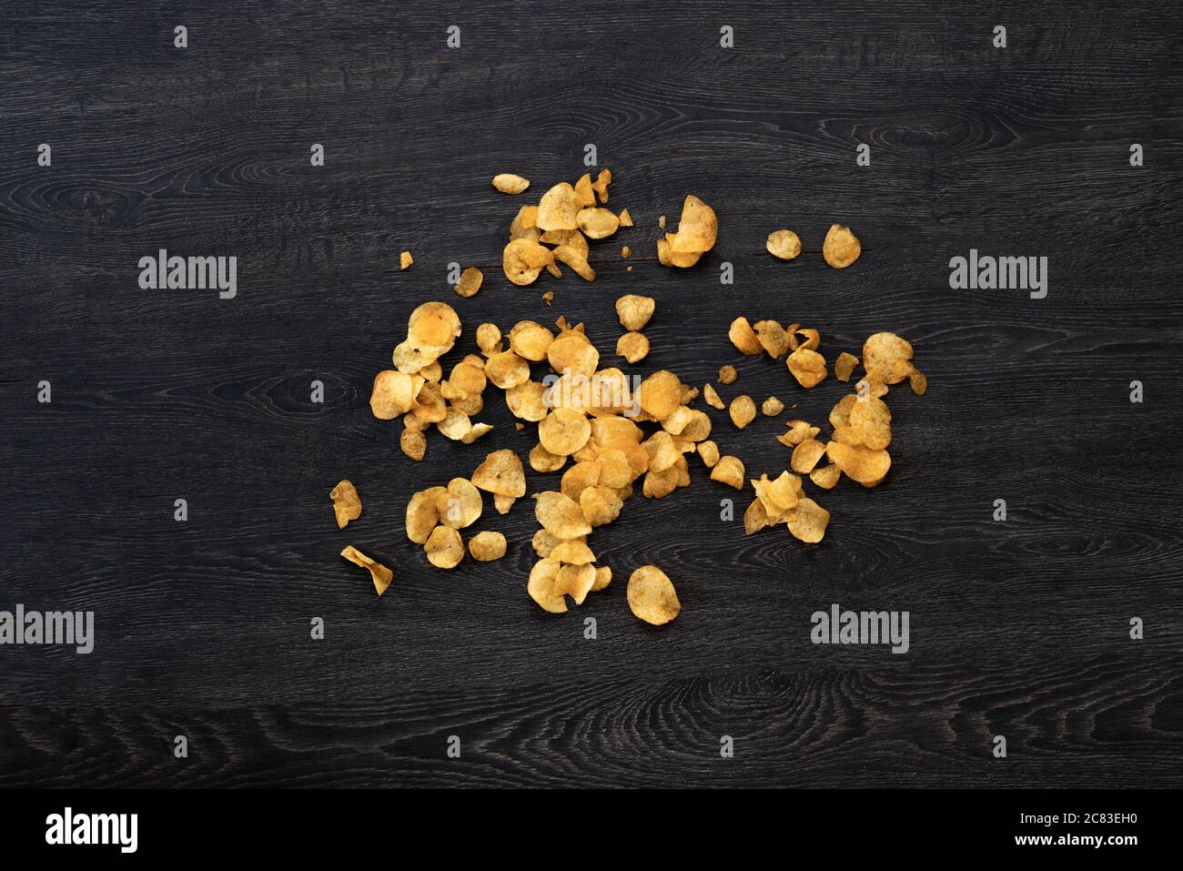 a messy bunch roasted potato chips flat lay on the colorful background ...
