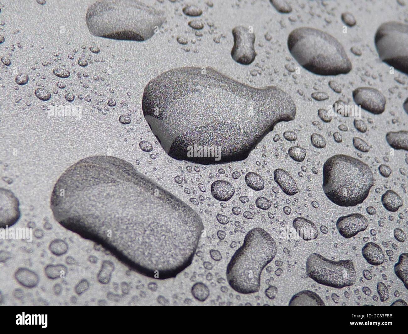 Closeup shot of waterdrops on a gray surface Stock Photo - Alamy
