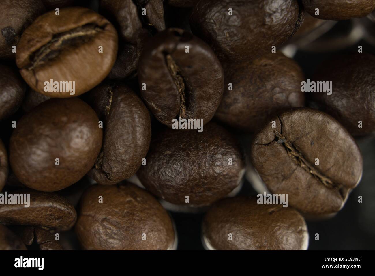 Fragrant fried coffee beans. close-up Stock Photo - Alamy