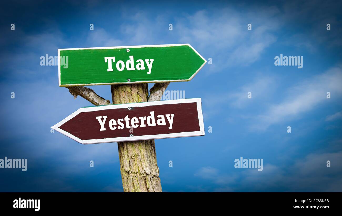 Wall Sign the Direction Way to Today versus Yesterday Stock Photo - Alamy