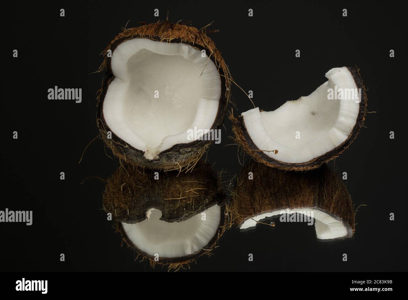 Coconut on a black background. Dark background Stock Photo - Alamy