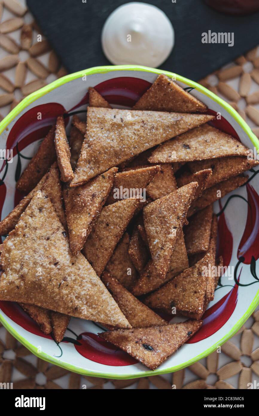 Vertical shot of homemade chips in the bowl Stock Photo - Alamy