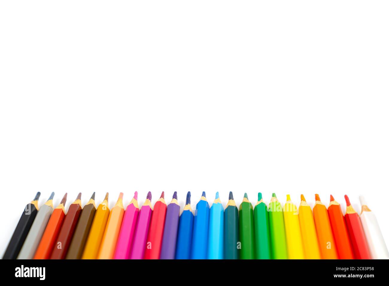 blunt colour pencils are arranged in the line on the white background ...