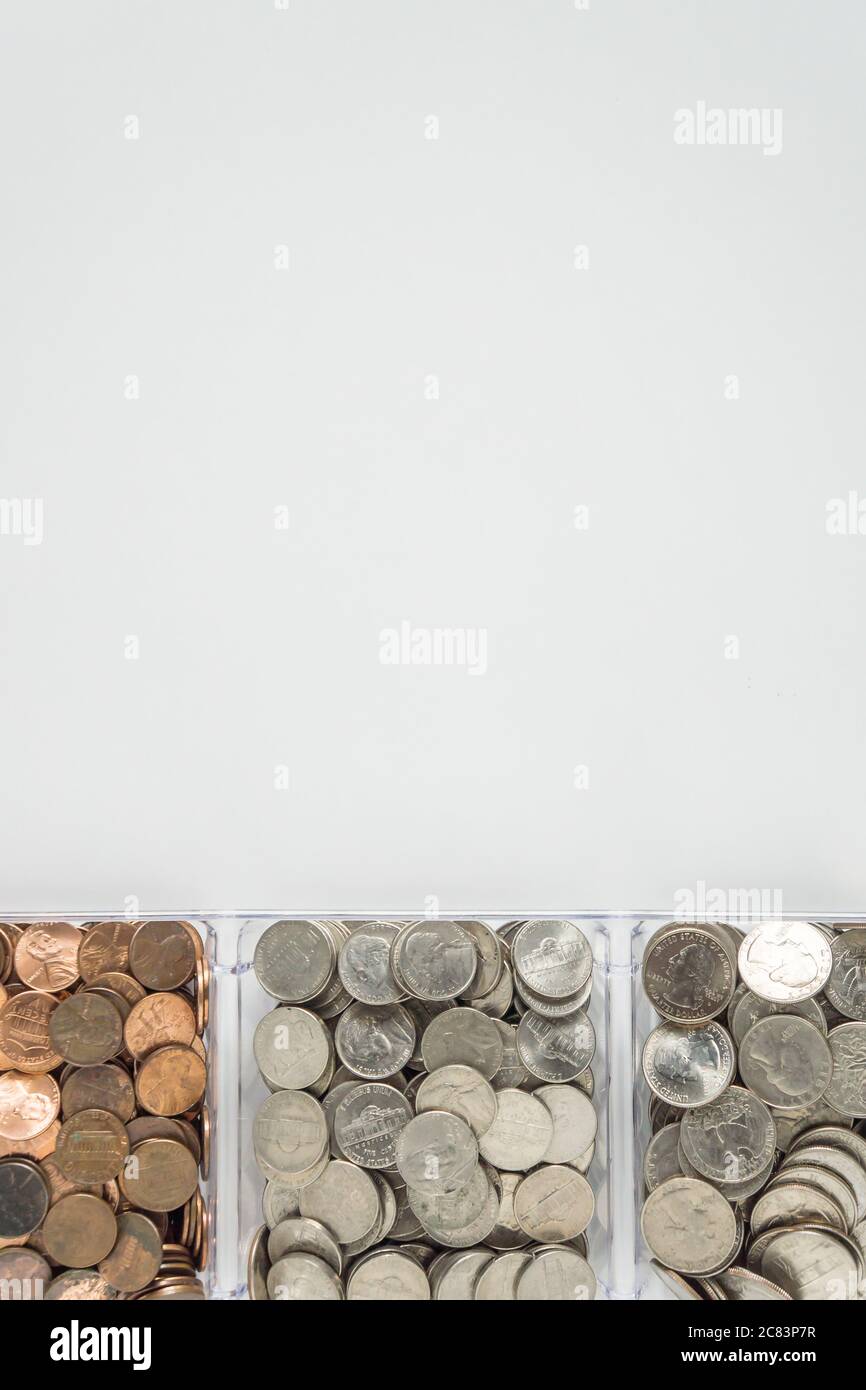 Overhead shot of cents in containers isolated on a grey background ...