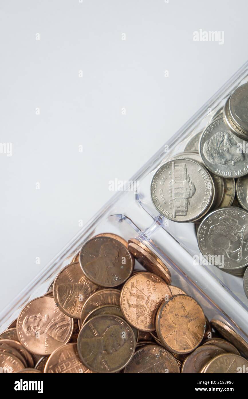 Overhead shot of cents in containers isolated on a grey background ...
