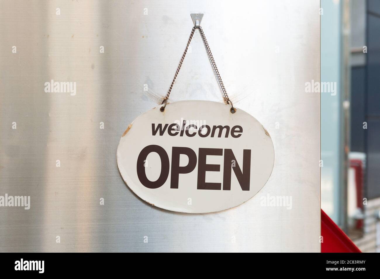 Open sign hanging on wooden wall in restaurant Stock Photo - Alamy
