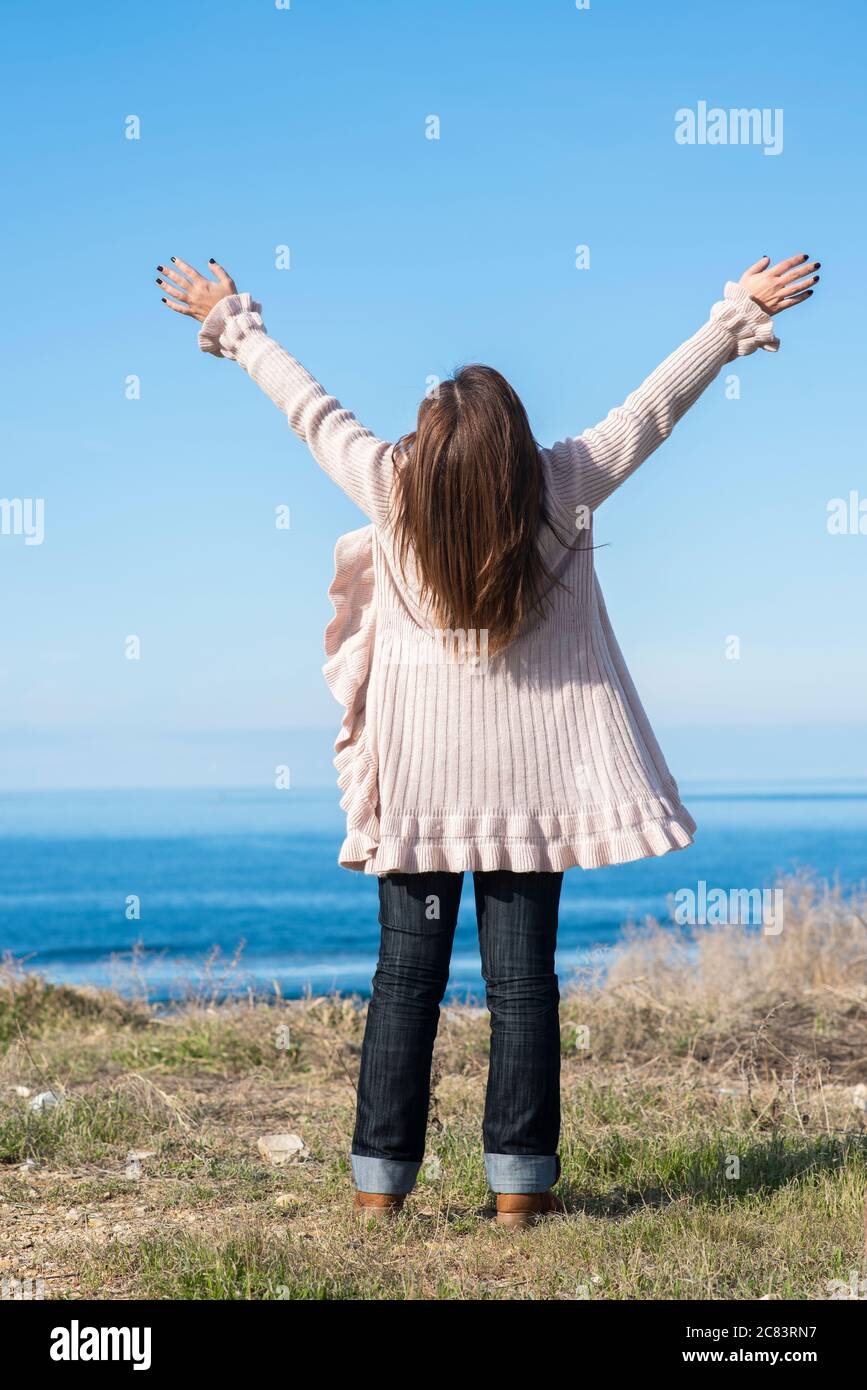 Arms behind back woman hi-res stock photography and images - Alamy