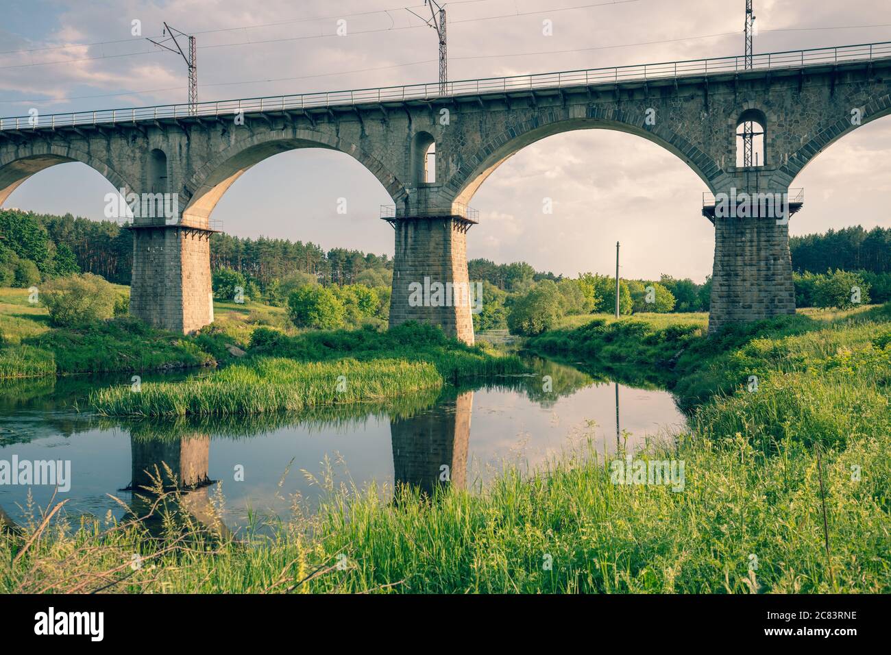 Old Arched Stone Railroad Viaduct Bridge over the river. Novohrad ...