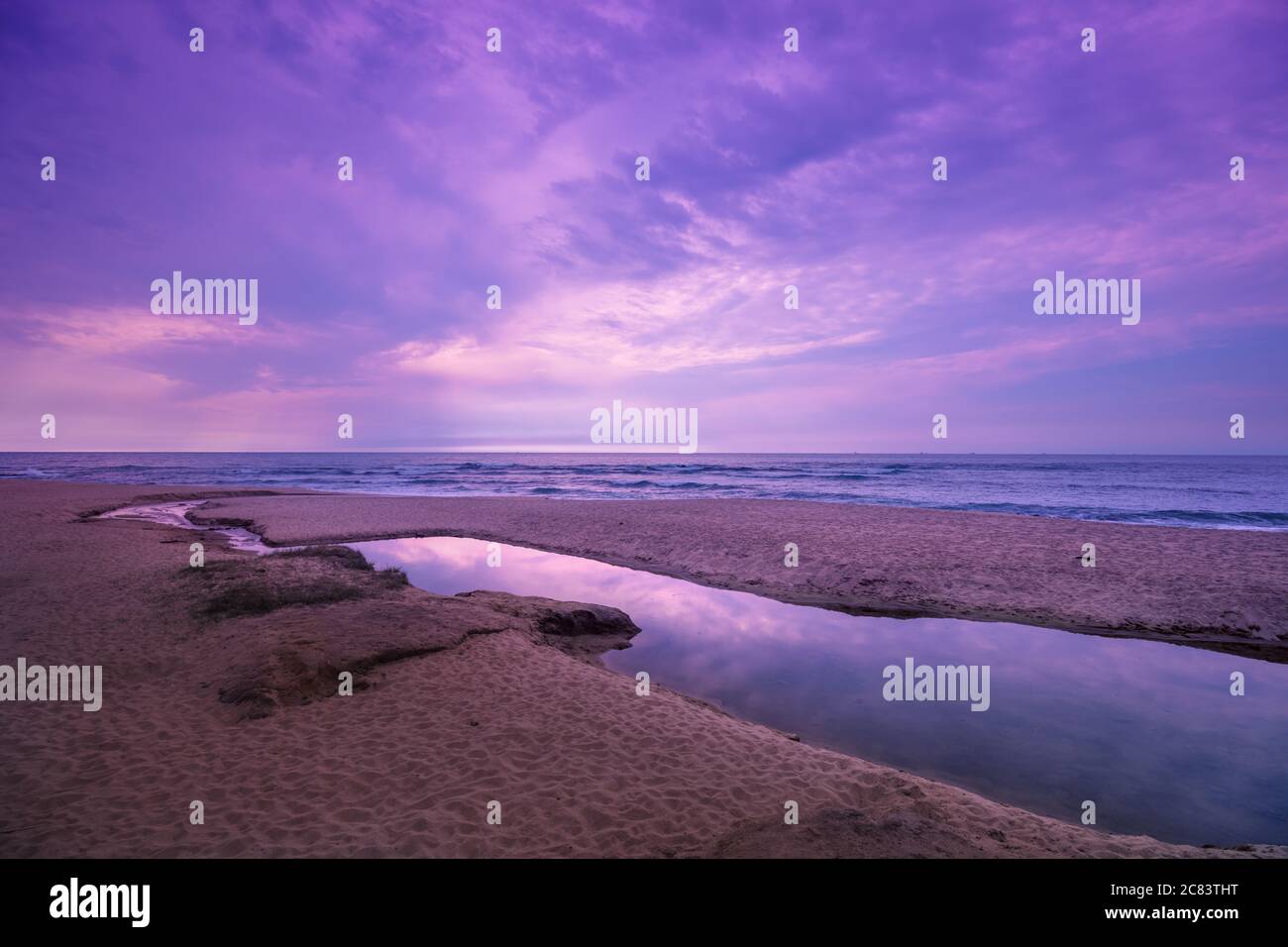 Water Flows Into The Sea At The Sandy Beach High Resolution Stock ...