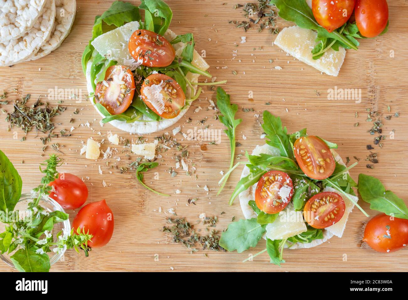 Angri, Italy. Food image of rice crackers snack with tomatoes, rocket ...