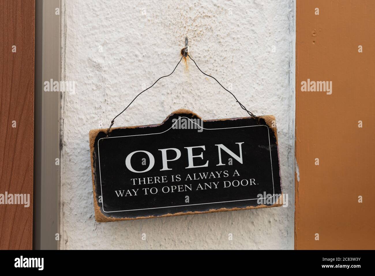Open sign hanging on wooden wall in restaurant Stock Photo - Alamy