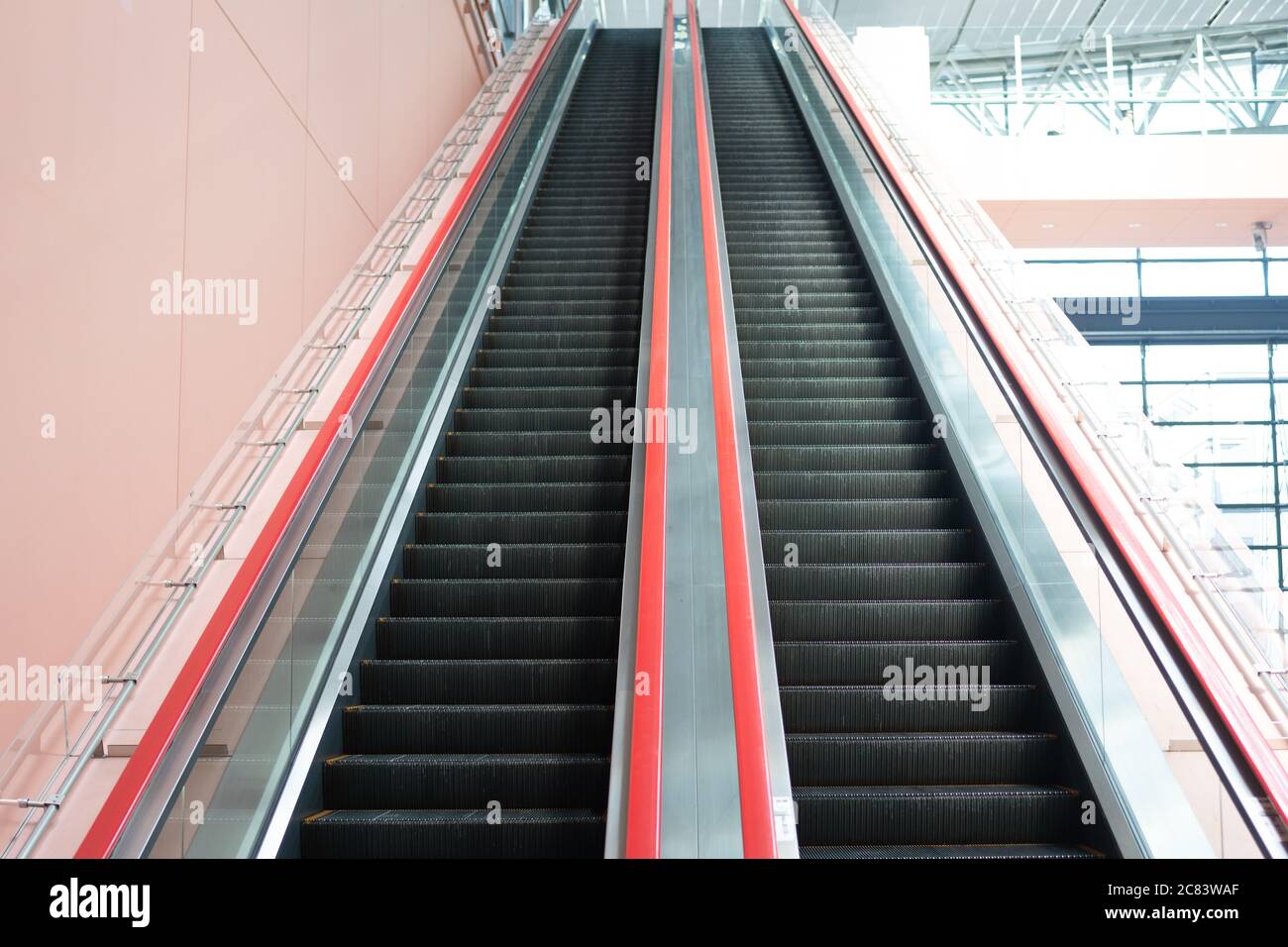 Escalator in shopping mall. Moving up and down staircase. electric escalator Stock Photo - Alamy