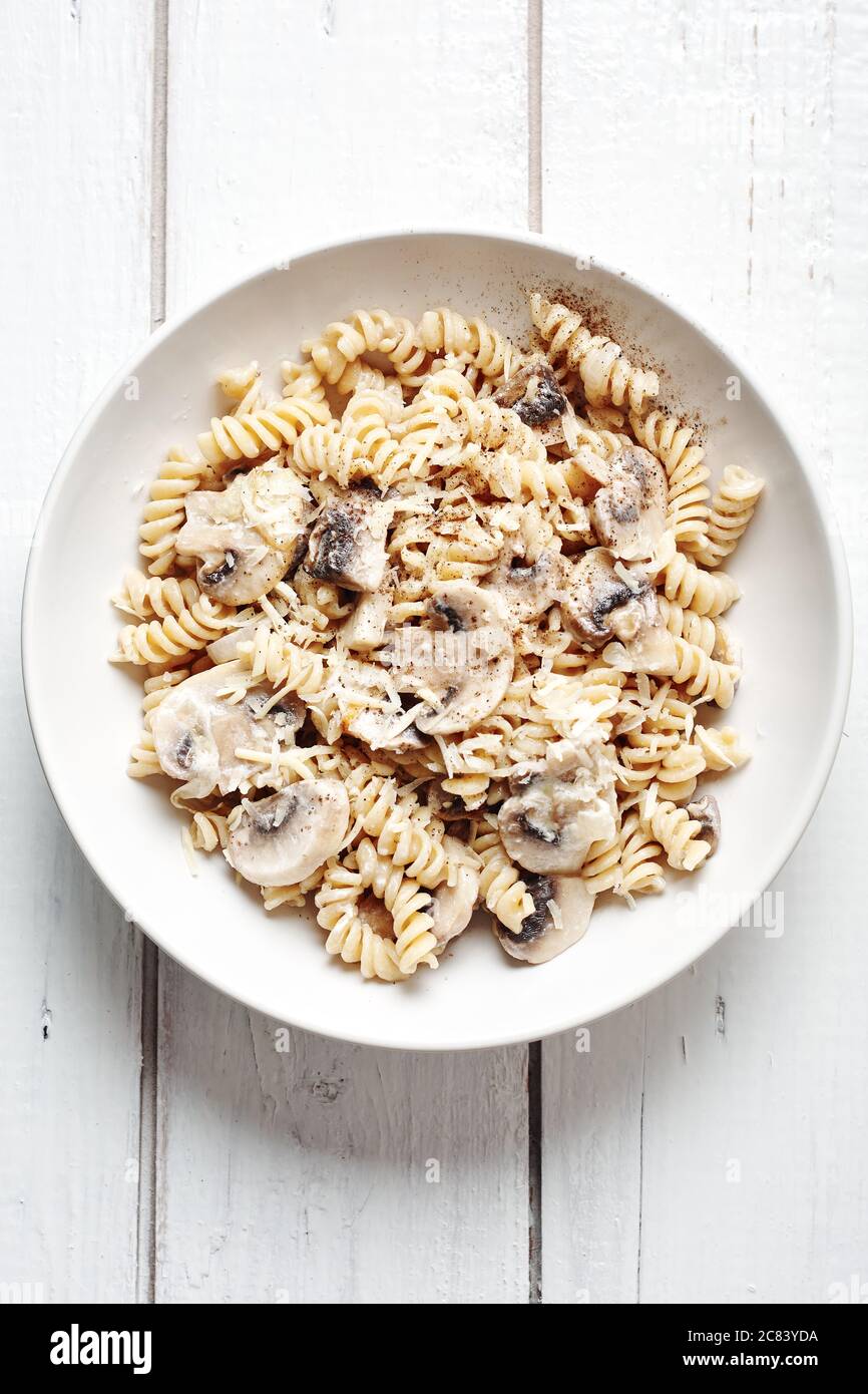 Fusilli pasta with mushrooms and cheese Stock Photo - Alamy