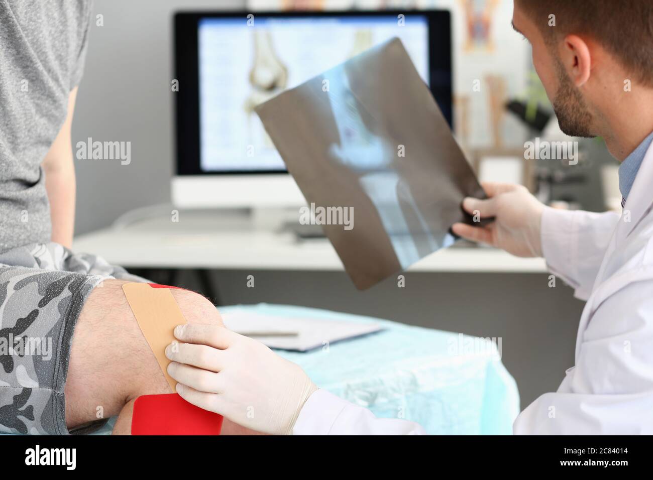 Man with tapes on leg visiting hospital for x-ray Stock Photo - Alamy