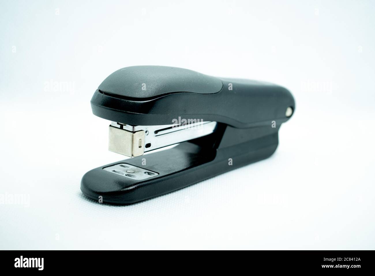 Black stapler isolated on a white background Stock Photo - Alamy