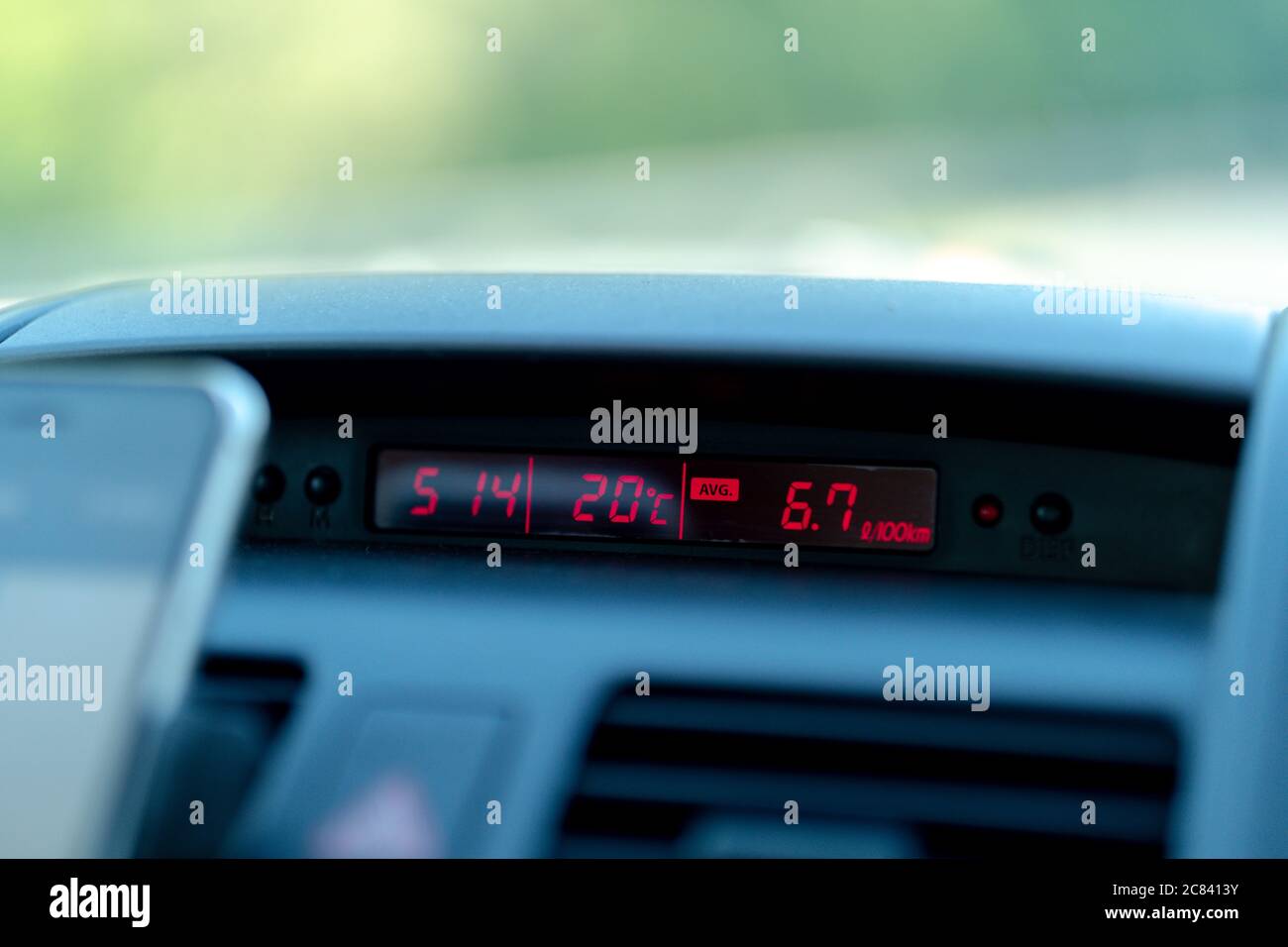 Time and temperature and speed written on the dashboard of a car Stock ...