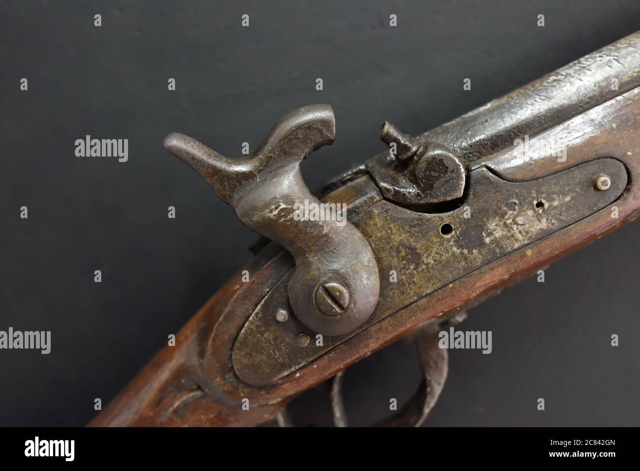 The cocked trigger of a flintlock, part of old-fashioned gun Stock ...