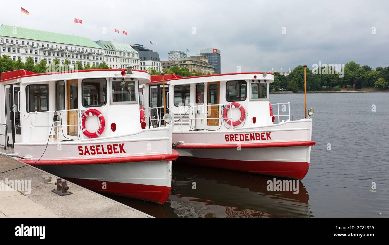 Two tour boats anchoring at the waterfront of the Binnenalster (Inner ...