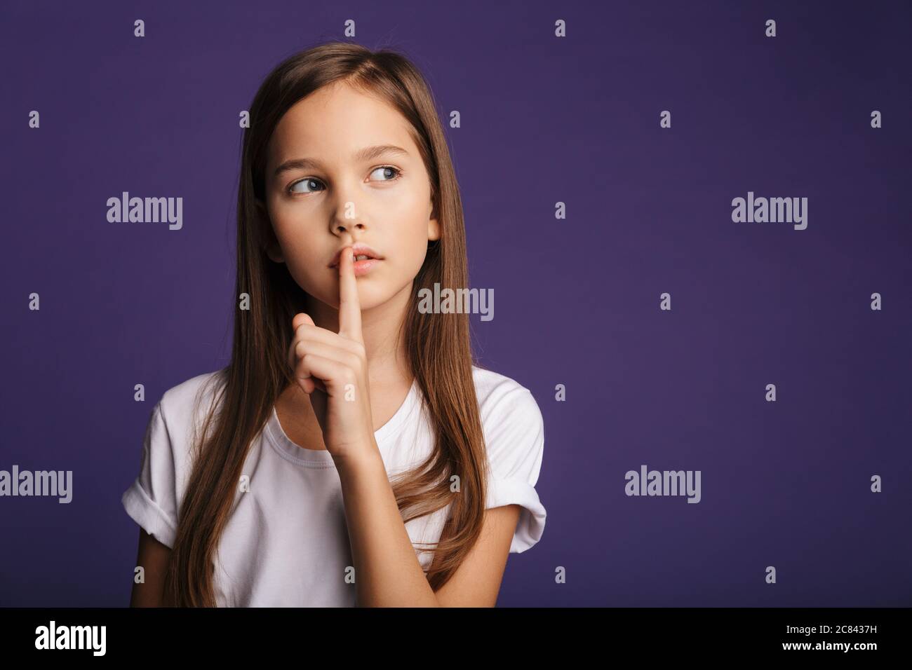 Photo of serious beautiful girl looking aside and making silence ...