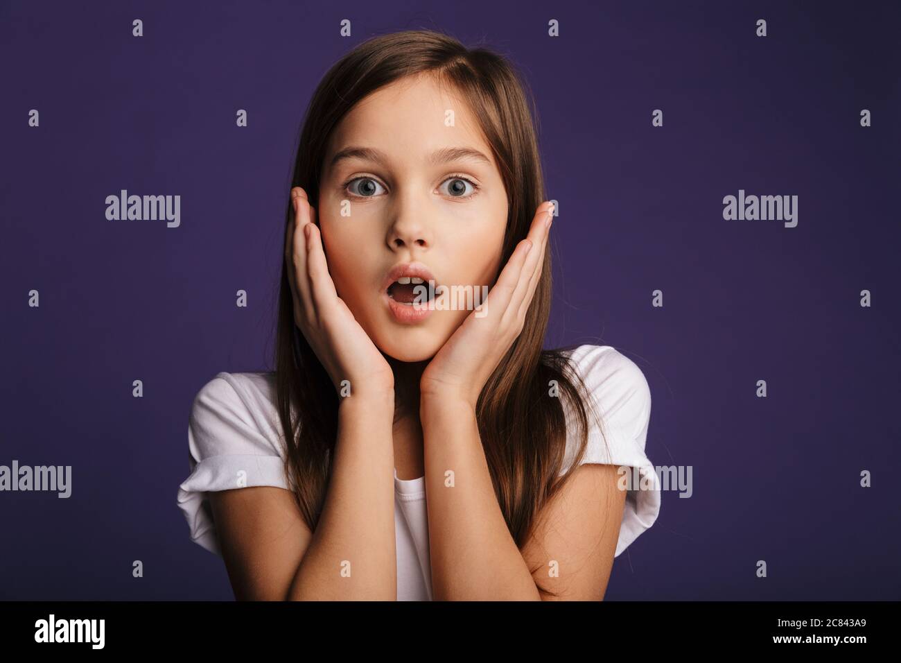 Photo of astonished pretty girl expressing shock on camera isolated ...