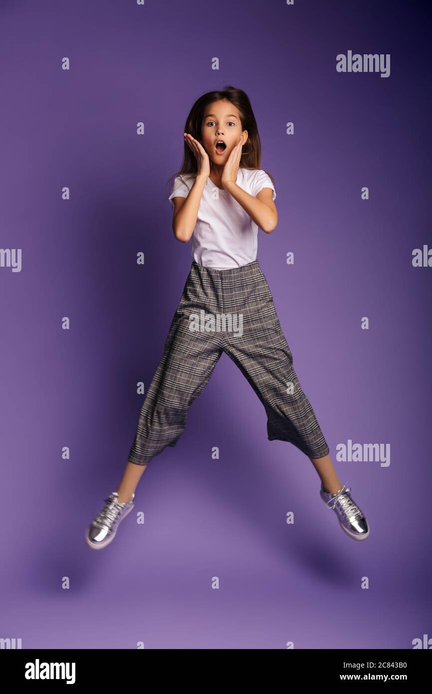 Photo of astonished pretty girl expressing shock on camera while ...