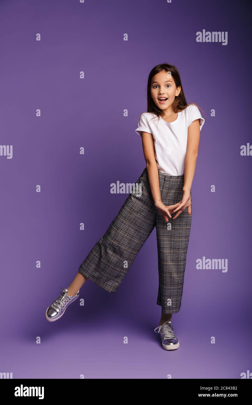 Full length photo of pleased caucasian girl smiling while dancing ...