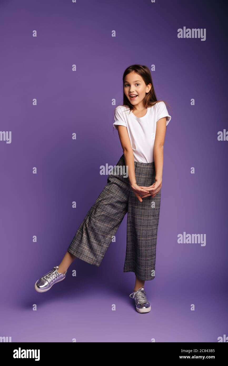 Full length photo of pleased caucasian girl smiling while dancing ...