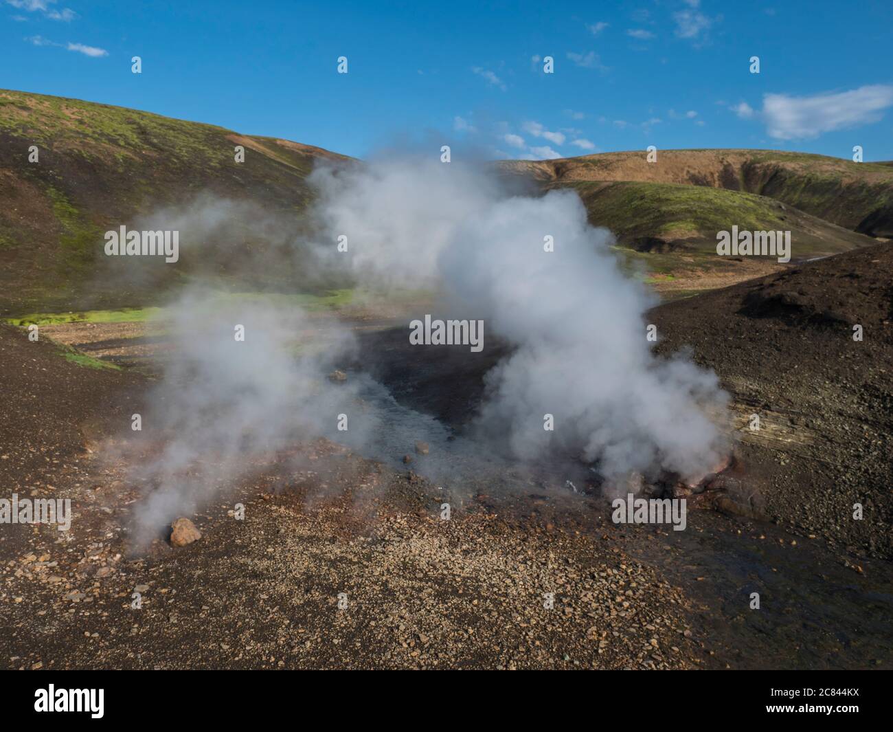 Hot spring with boiling water rising from rocks in Landmannalaugar ...