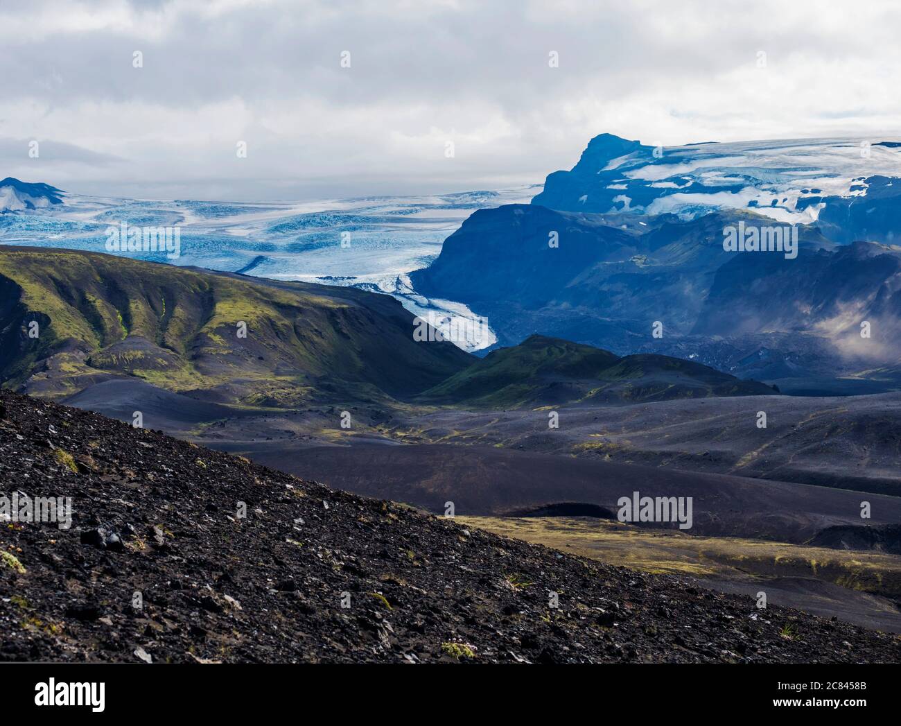 Icelandic lava desert landscape with Tindfjallajokull glacier tongue ...