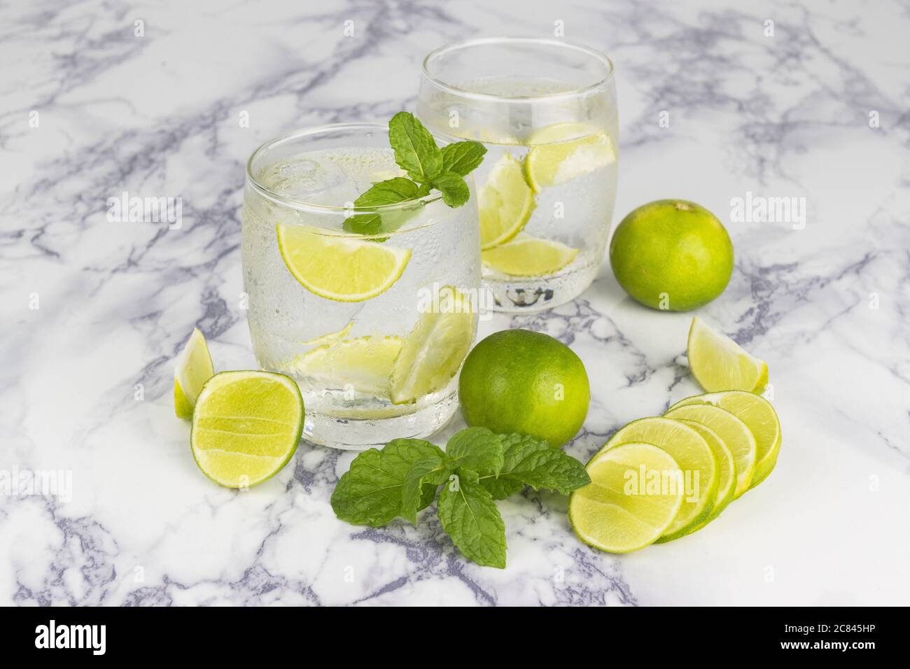 Cold Drink from Lemon cut into pieces in water glass Stock Photo - Alamy