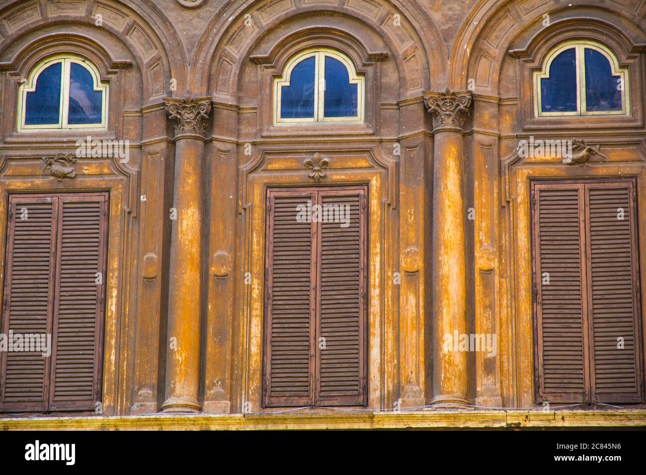 Window shutters on a building in Rome Italy Stock Photo - Alamy