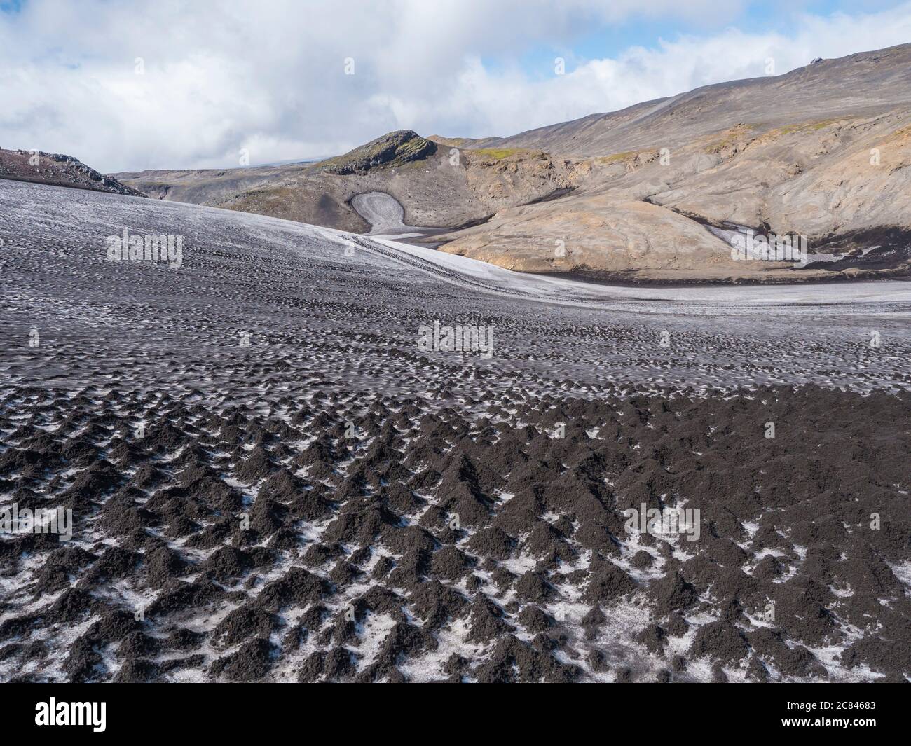 Landscape of Fimmvorduhals hiking trail with close up snow filed ...