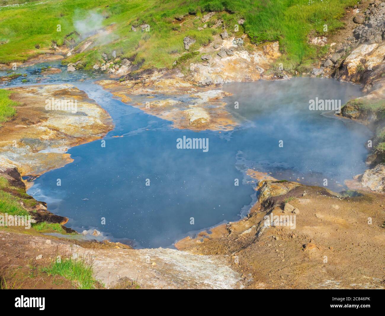 Reykjadalur valley with hot springs river and pool with lush green ...