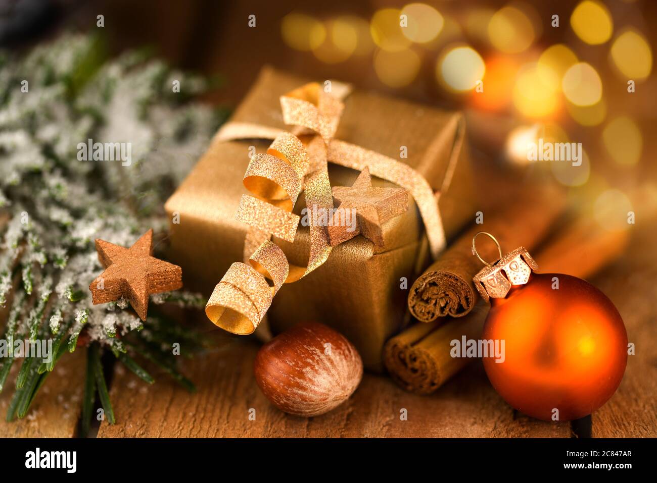Golden Christmas gift with bokeh effect Stock Photo - Alamy