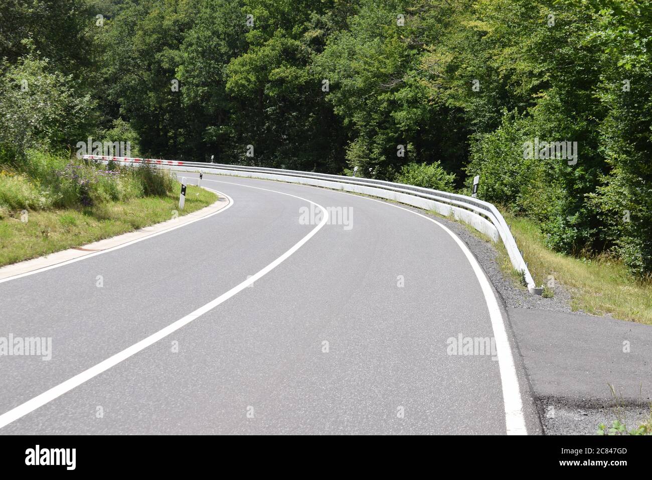 twisted road through the Eifel in summer Stock Photo - Alamy