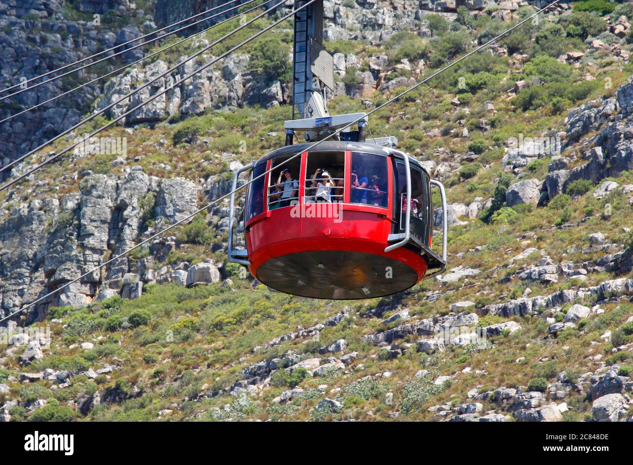 One of the Table Mountain cable-cars on its way up to the top of Table ...