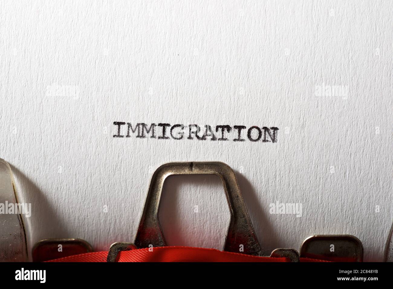 Immigration word written with a typewriter Stock Photo - Alamy
