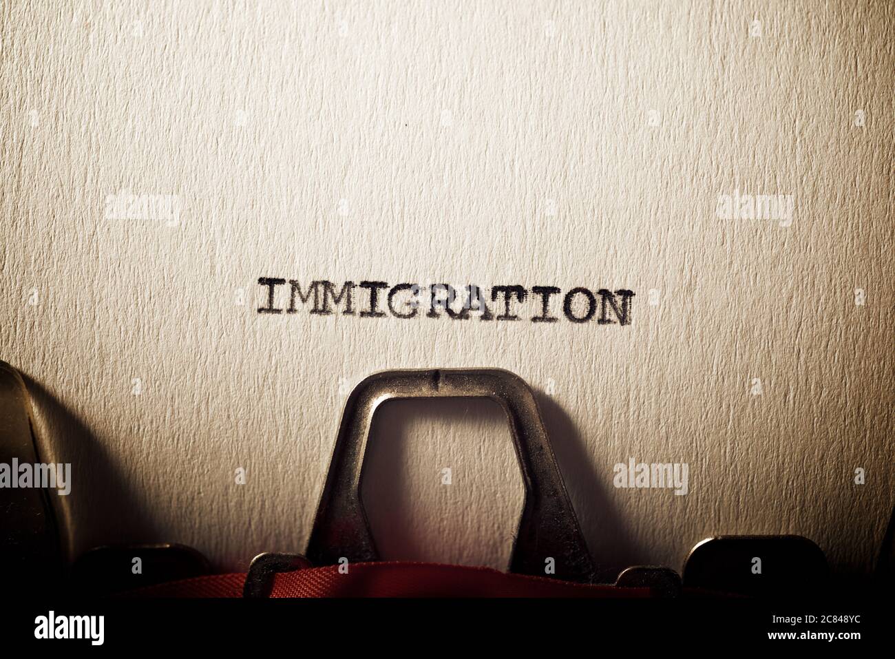 Immigration word written with a typewriter Stock Photo - Alamy