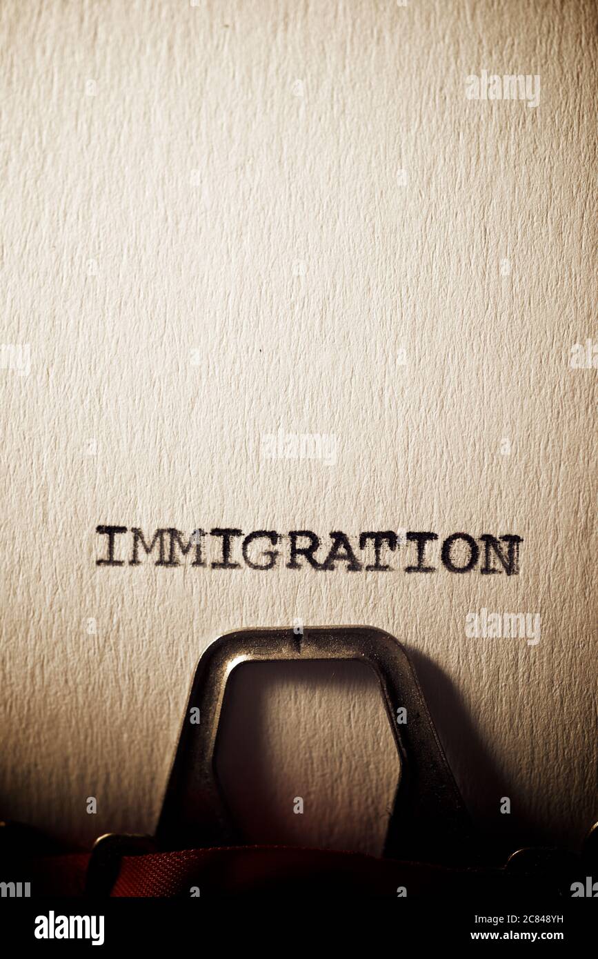 Immigration word written with a typewriter Stock Photo - Alamy