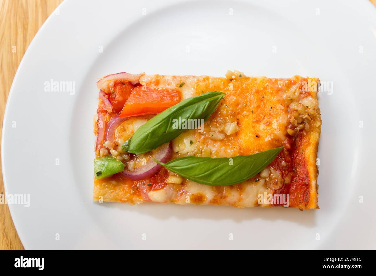 Italian Pizza from above on white plate Stock Photo - Alamy