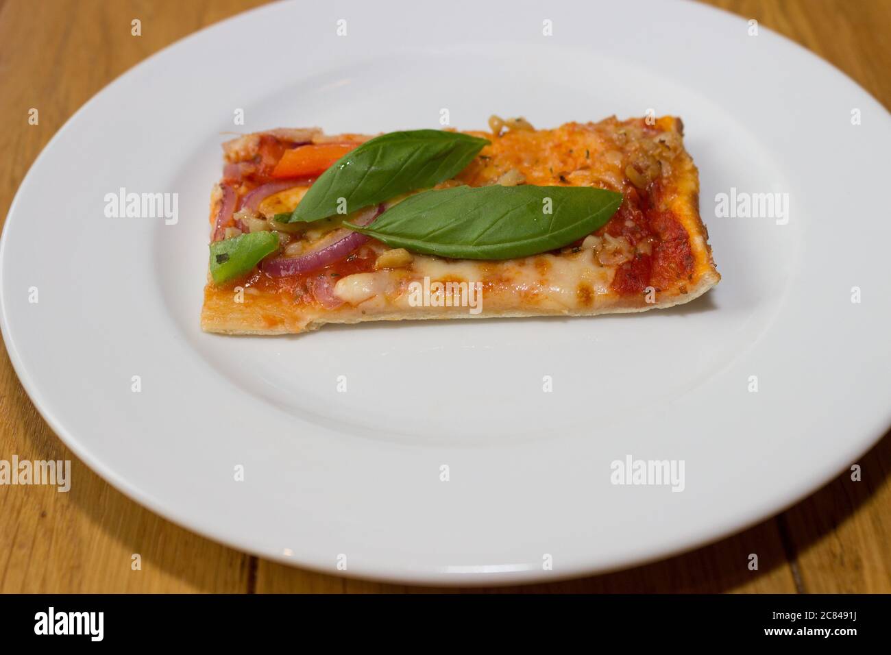 Italian Pizza from above on white plate Stock Photo - Alamy