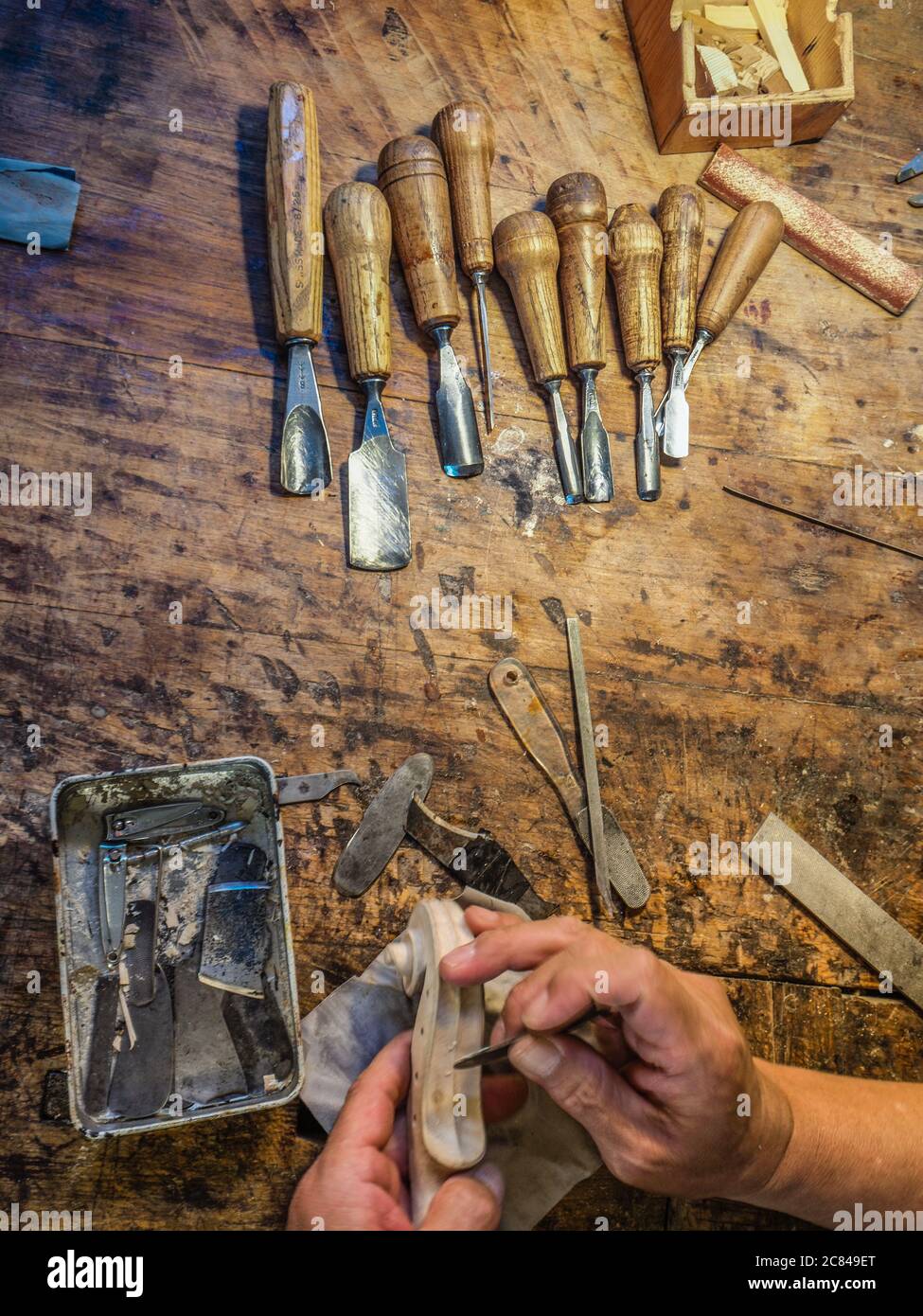 Hands of luthier violin maker carving and working on a instrument ...